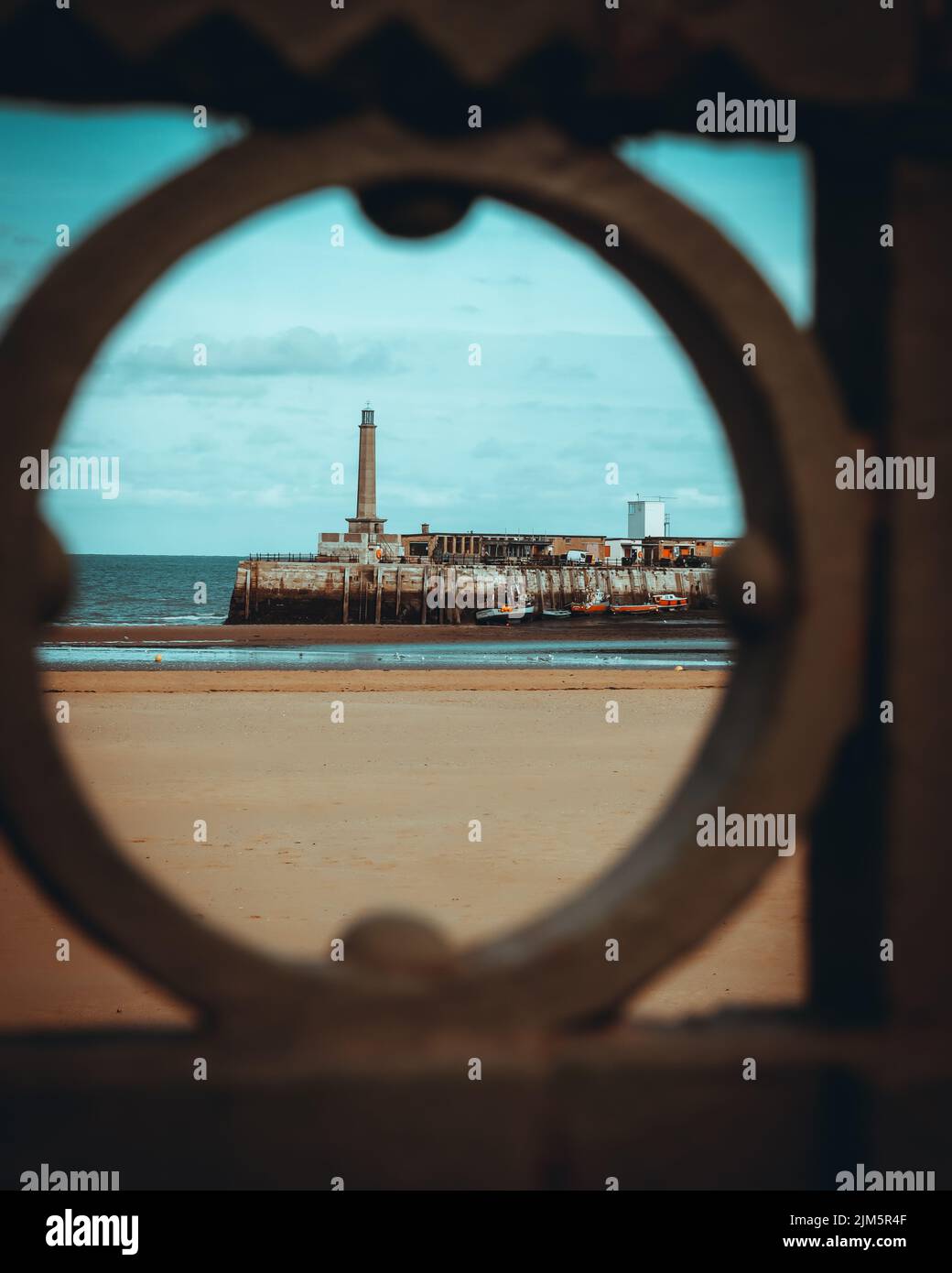 Big ship in a port seen from a porthole Stock Photo - Alamy
