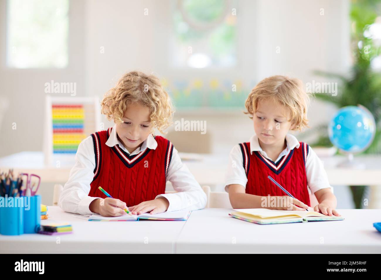 Kids in school. Preschool children in class. Happy kids back to school ...