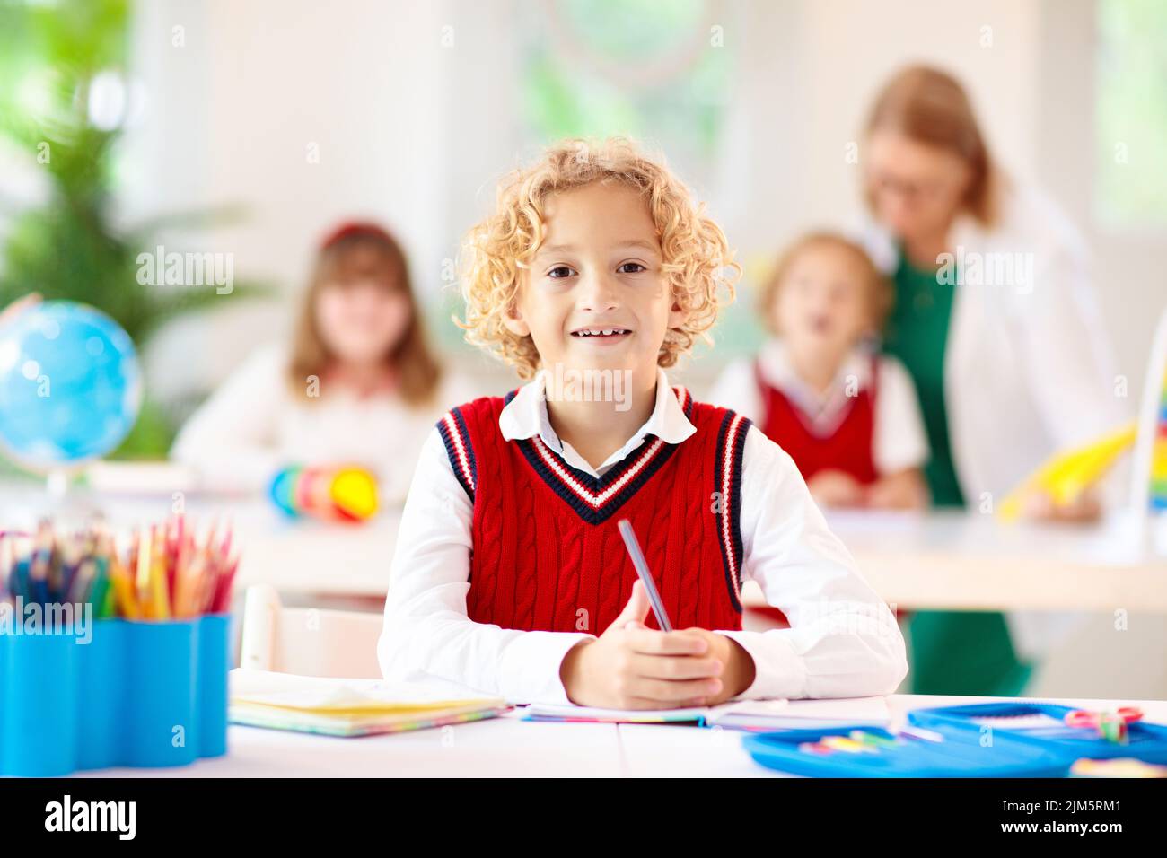 Kids in school. Preschool children in class. Happy kids back to school ...