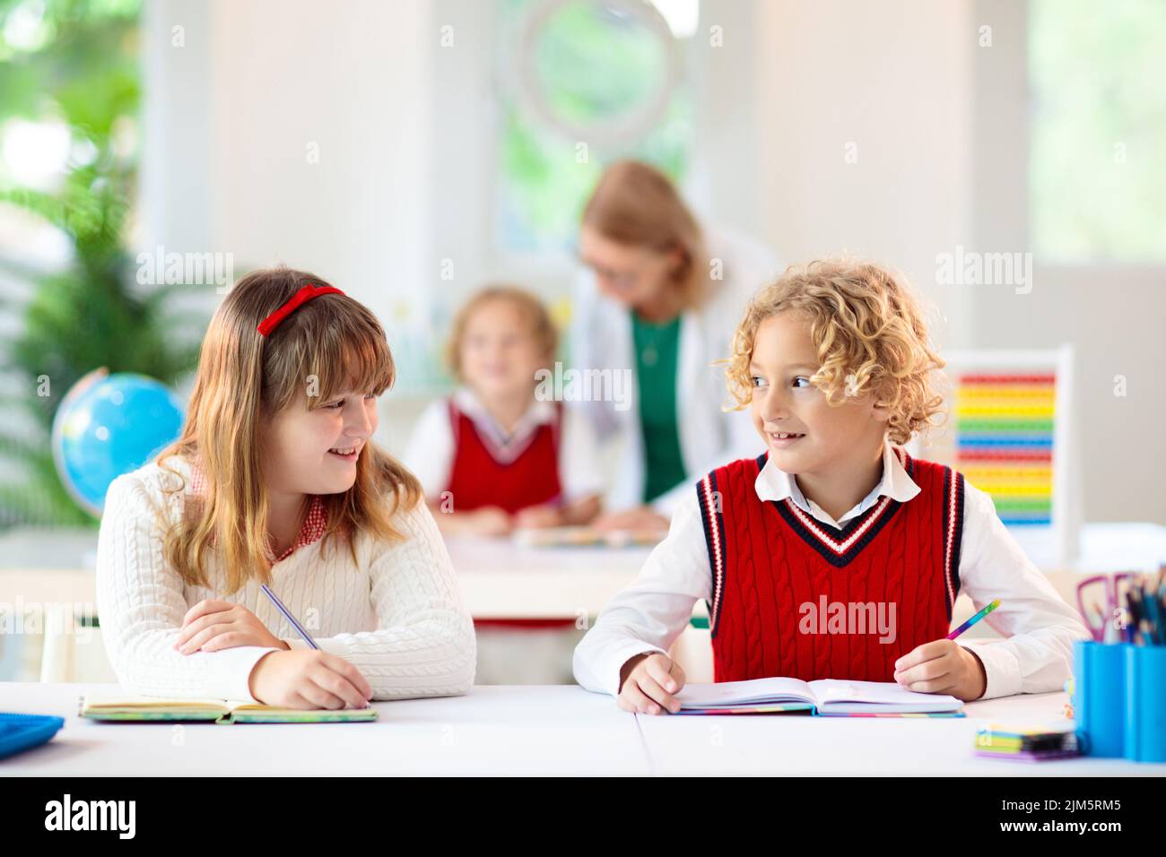 Kids in school. Preschool children in class. Happy kids back to school ...