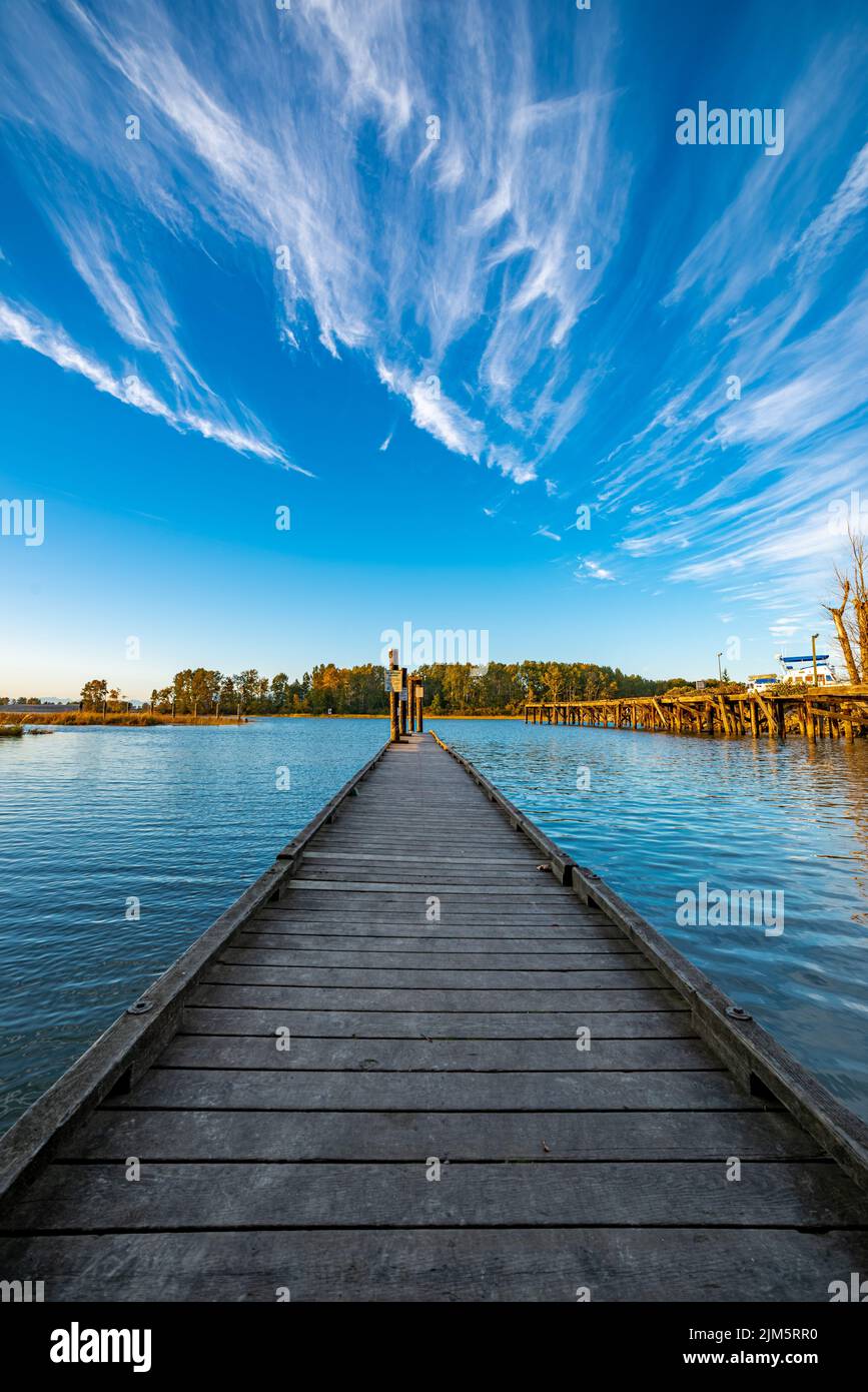A wooden dock facing the front shore in Ladner, British Columbia Stock ...