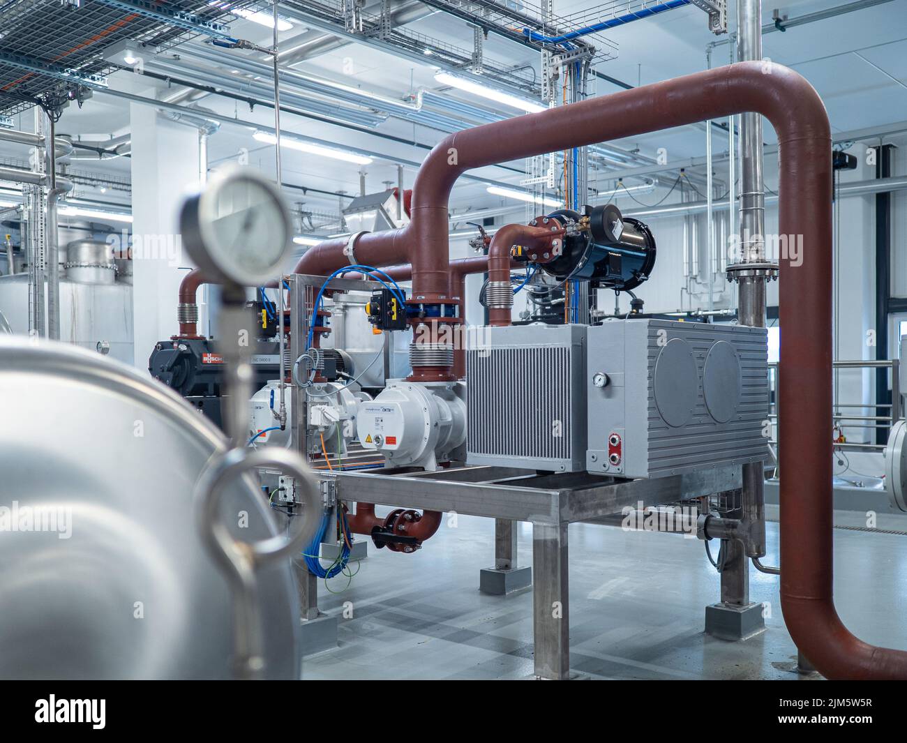 An inside view of pipe lines in a factory Stock Photo - Alamy