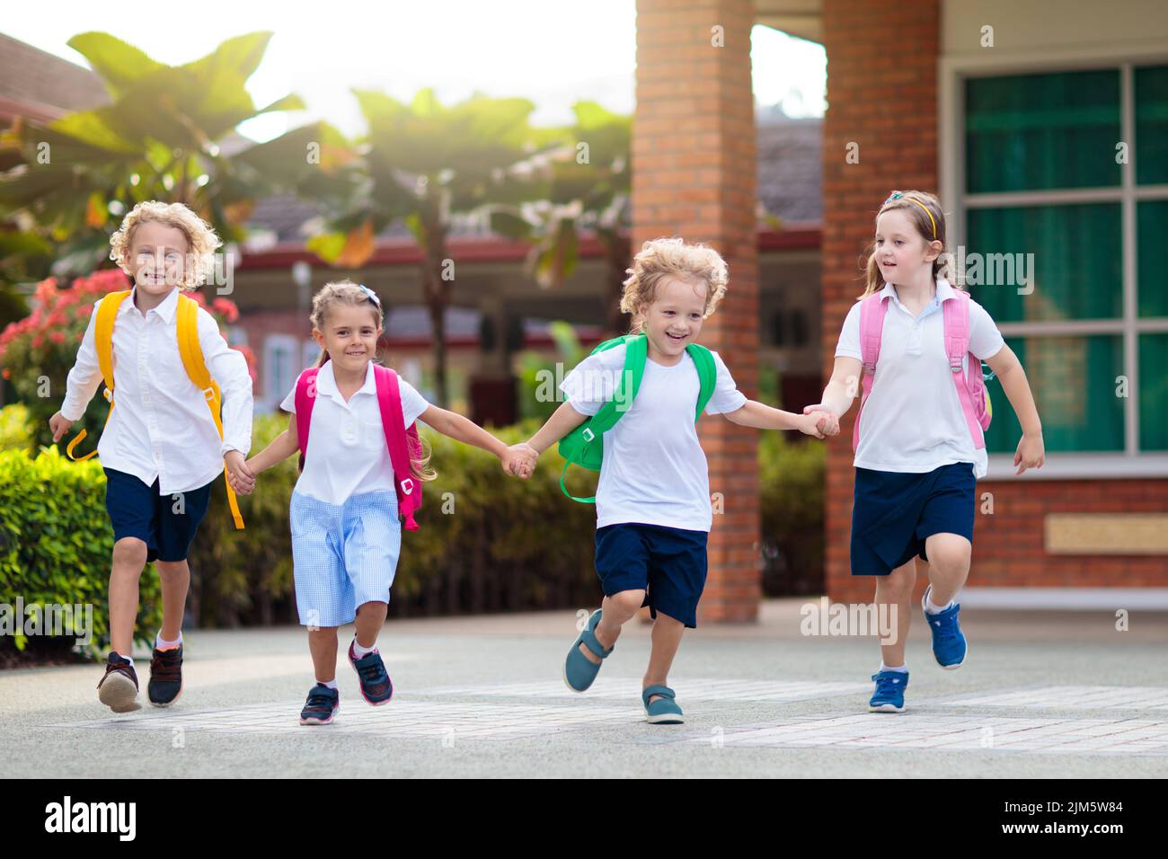 Child going to school. Boy and girl holding books and pencils on the ...