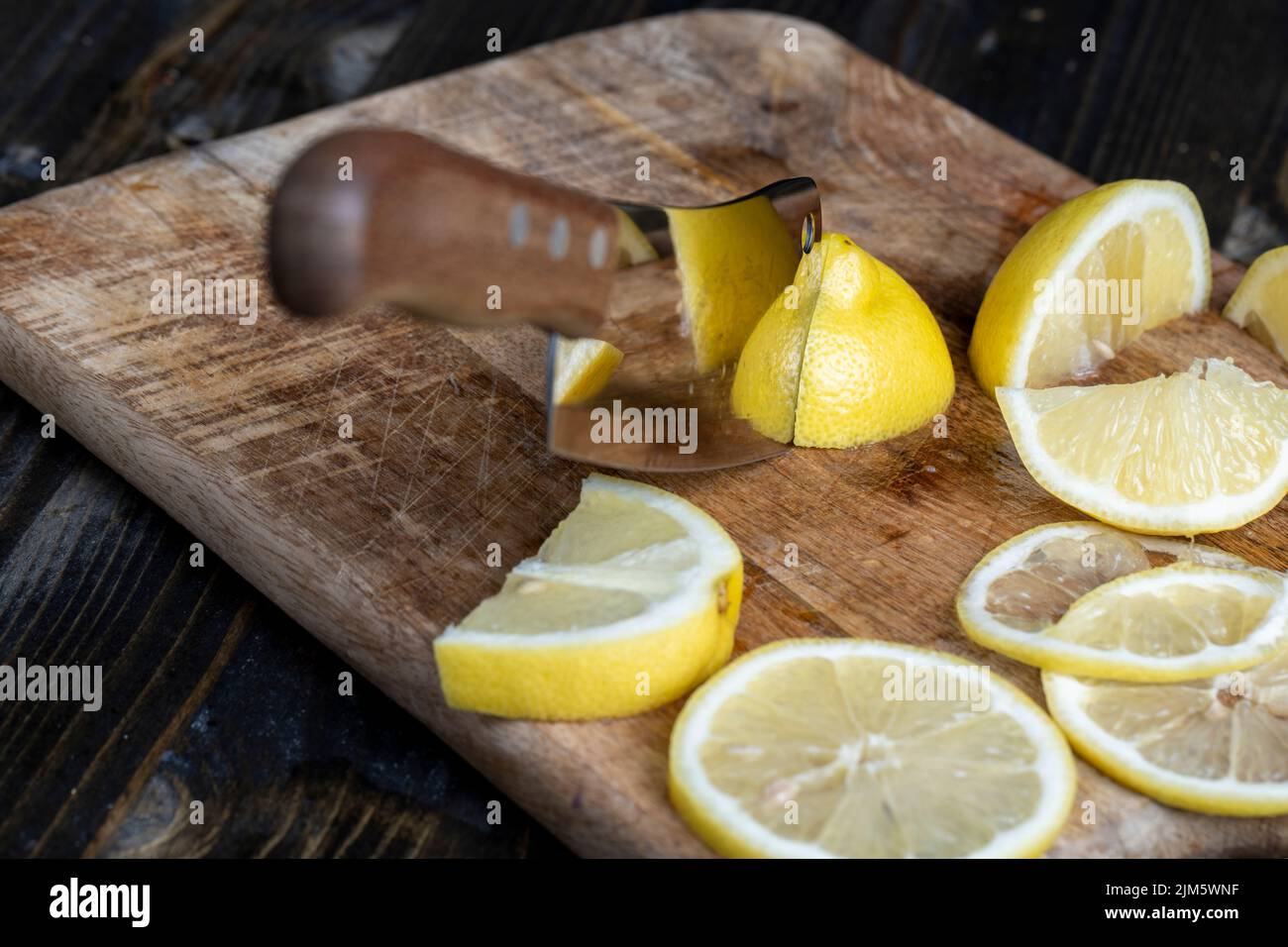 Ripe yellow lemon cut into pieces Stock Photo - Alamy
