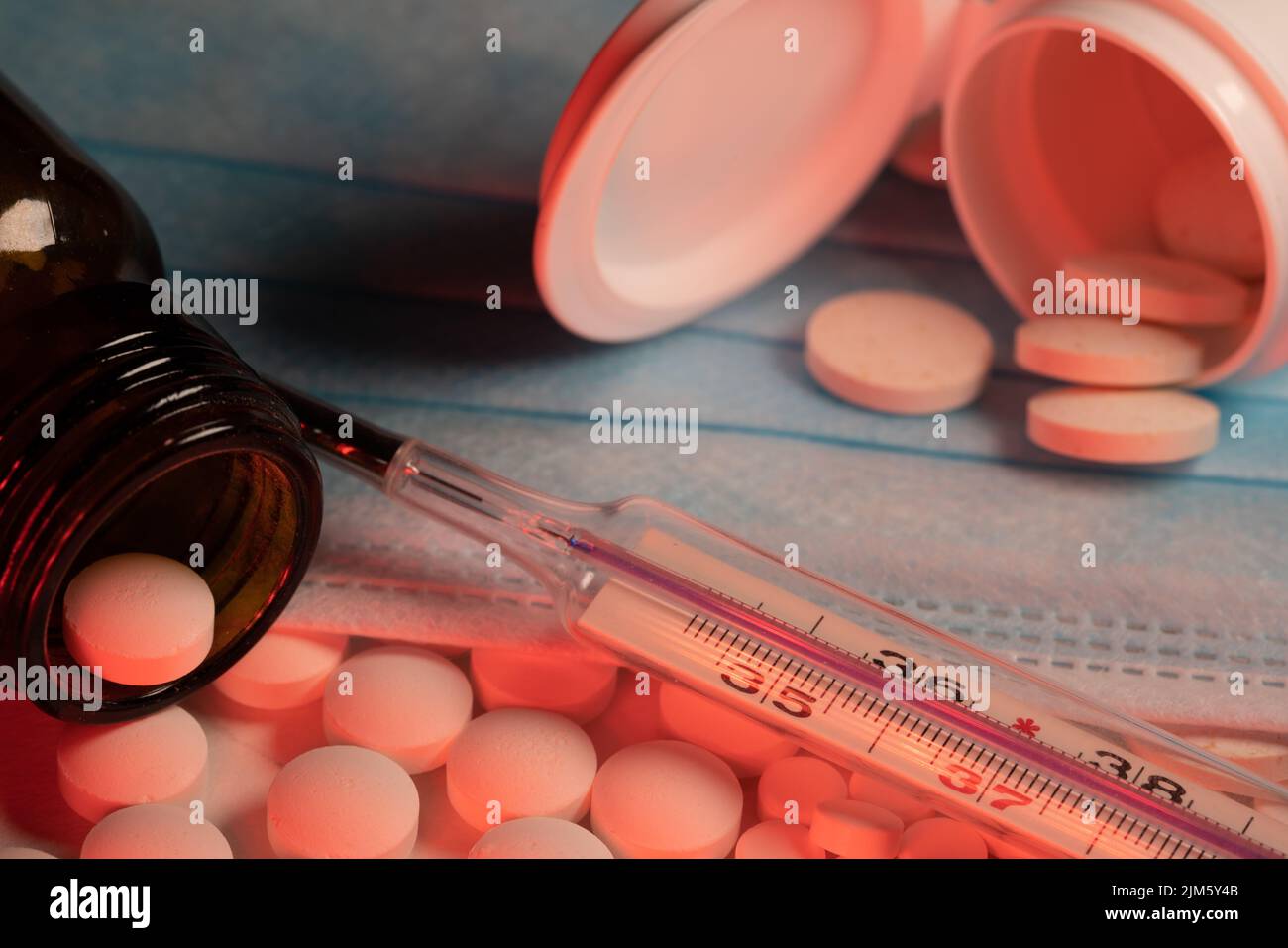 Blue Clinical mask with glass mercury rising Thermometer. Diagnostic ...