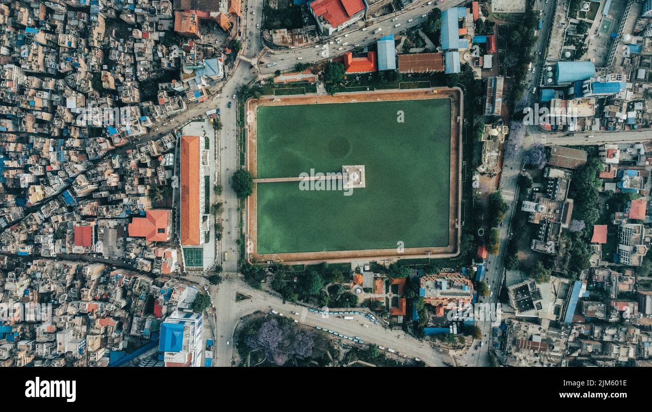 An aerial view of the Ranipokhari and buildings around in bright ...