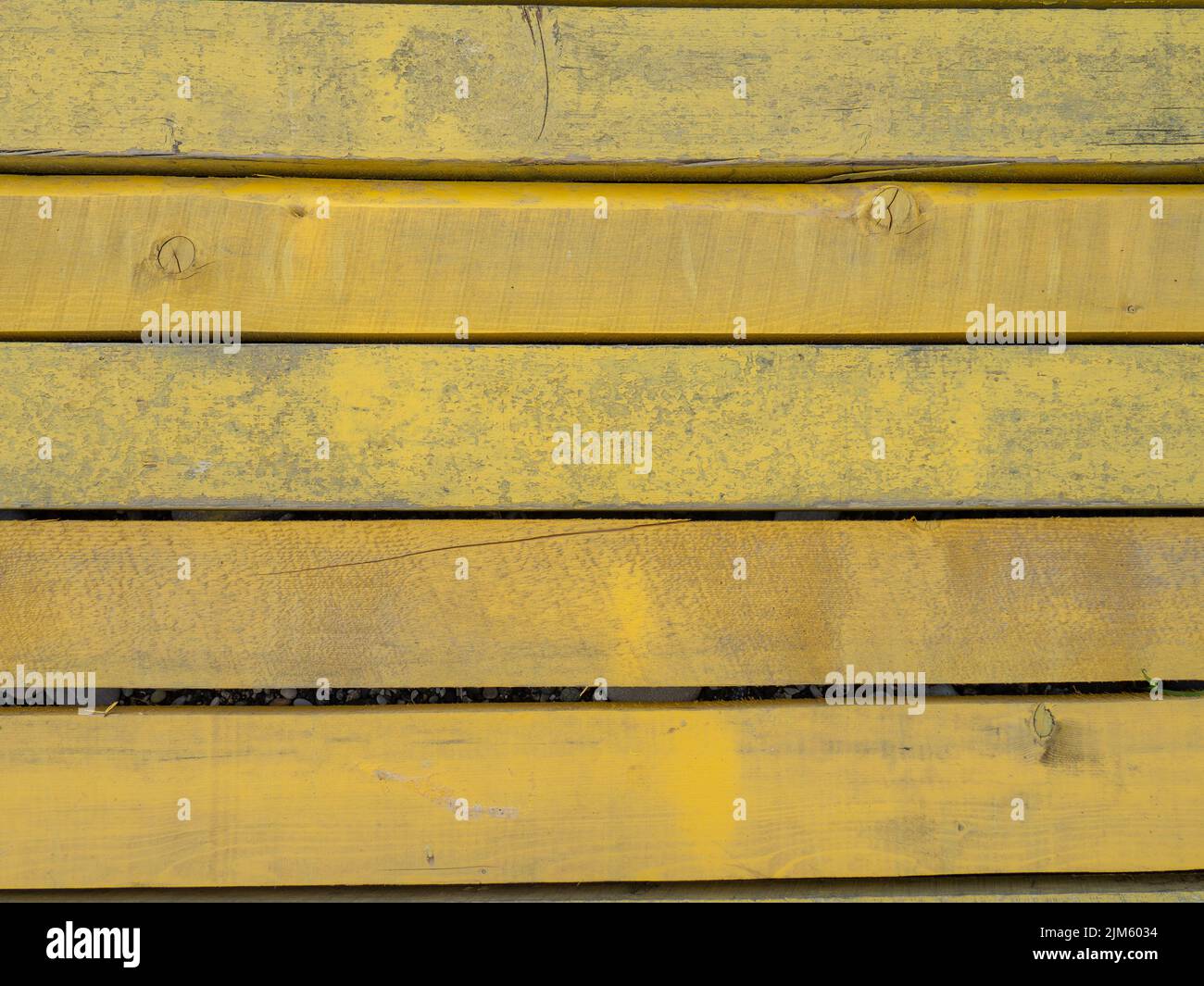 Boards painted yellow. Wood background. Wall made of natural material ...