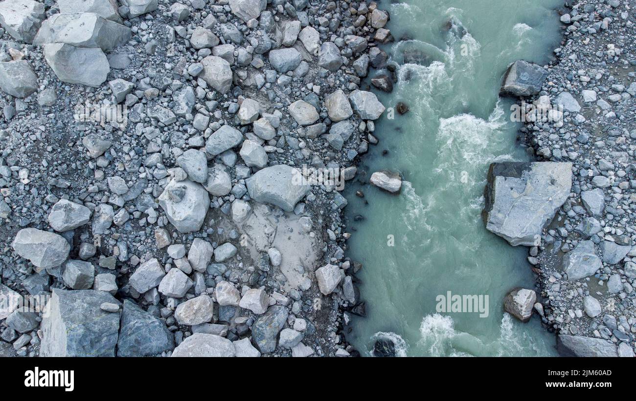 An aerial view of river surrounded by rocks Stock Photo - Alamy