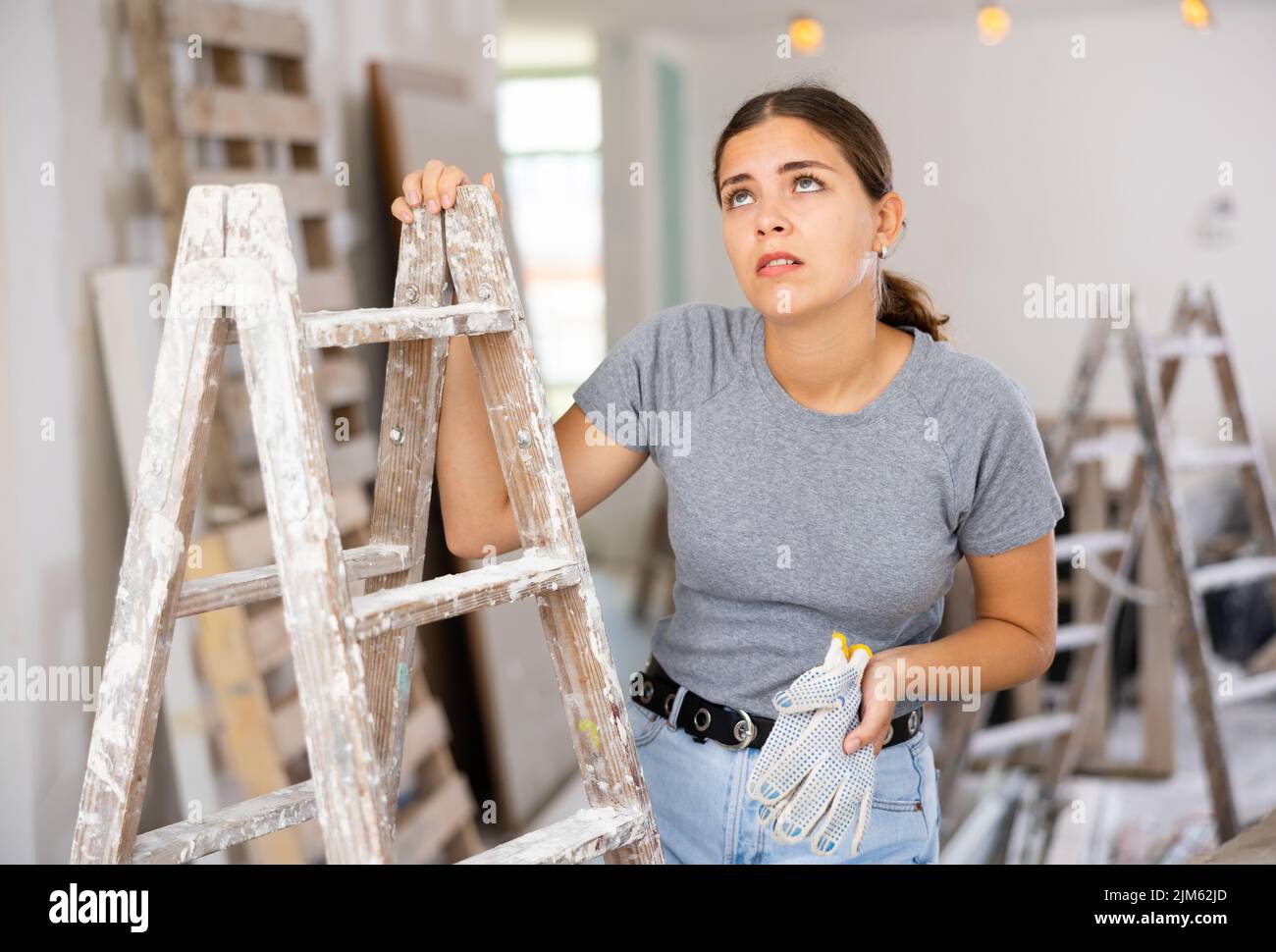 Portrait of tired woman in apartment during repair works Stock Photo ...
