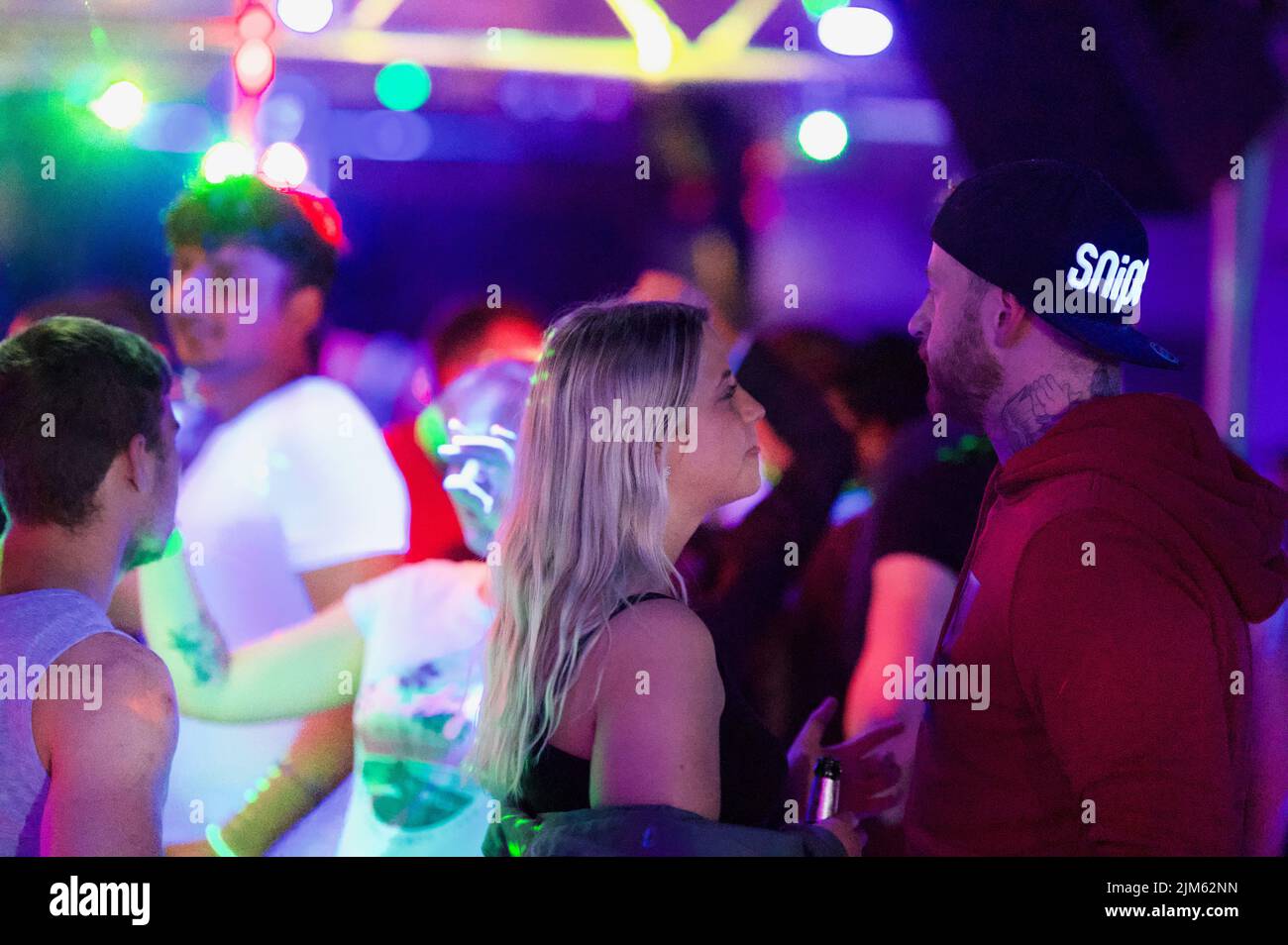 Many young people smiling and having fun during a party Stock Photo - Alamy