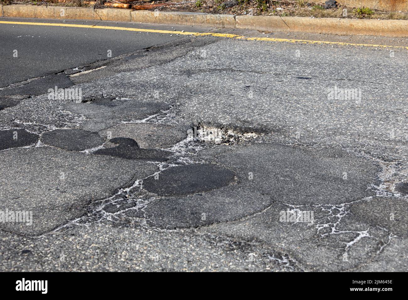 The pot holes on asphalt roadway Stock Photo - Alamy