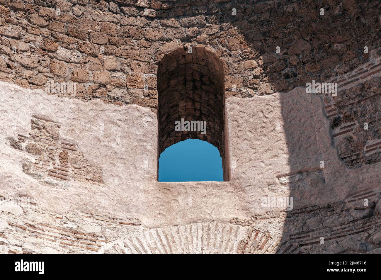A beautiful shot of a window on a circular shaped building inside a ...