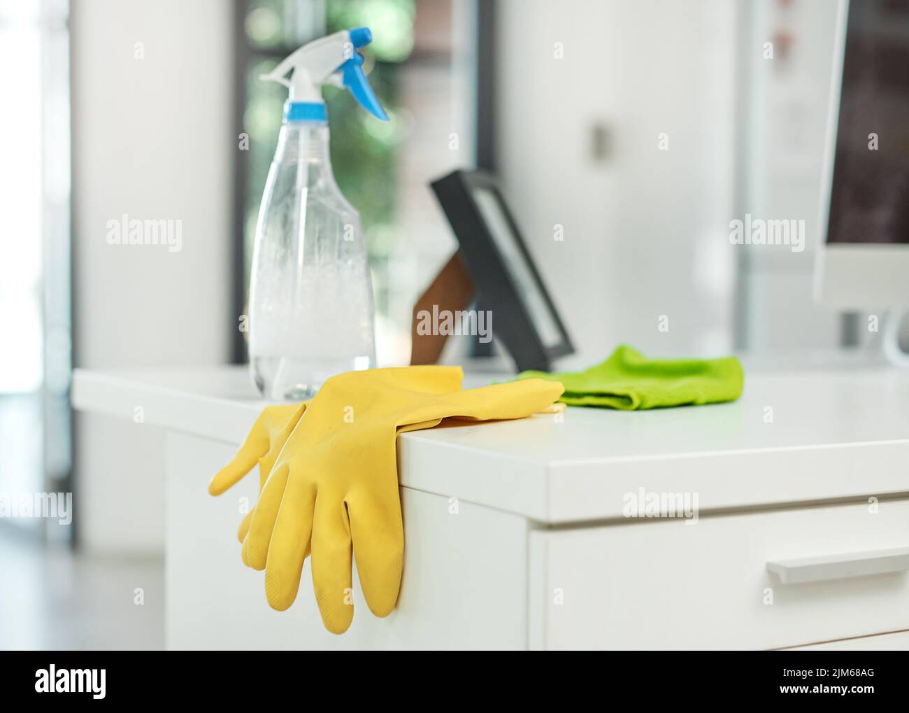 A clean office is a safe office. a pair of rubber gloves and ...