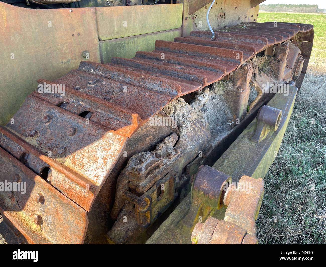 Burke County, Ga USA - 02 10 22: Old abandoned rusted tractor wheel ...