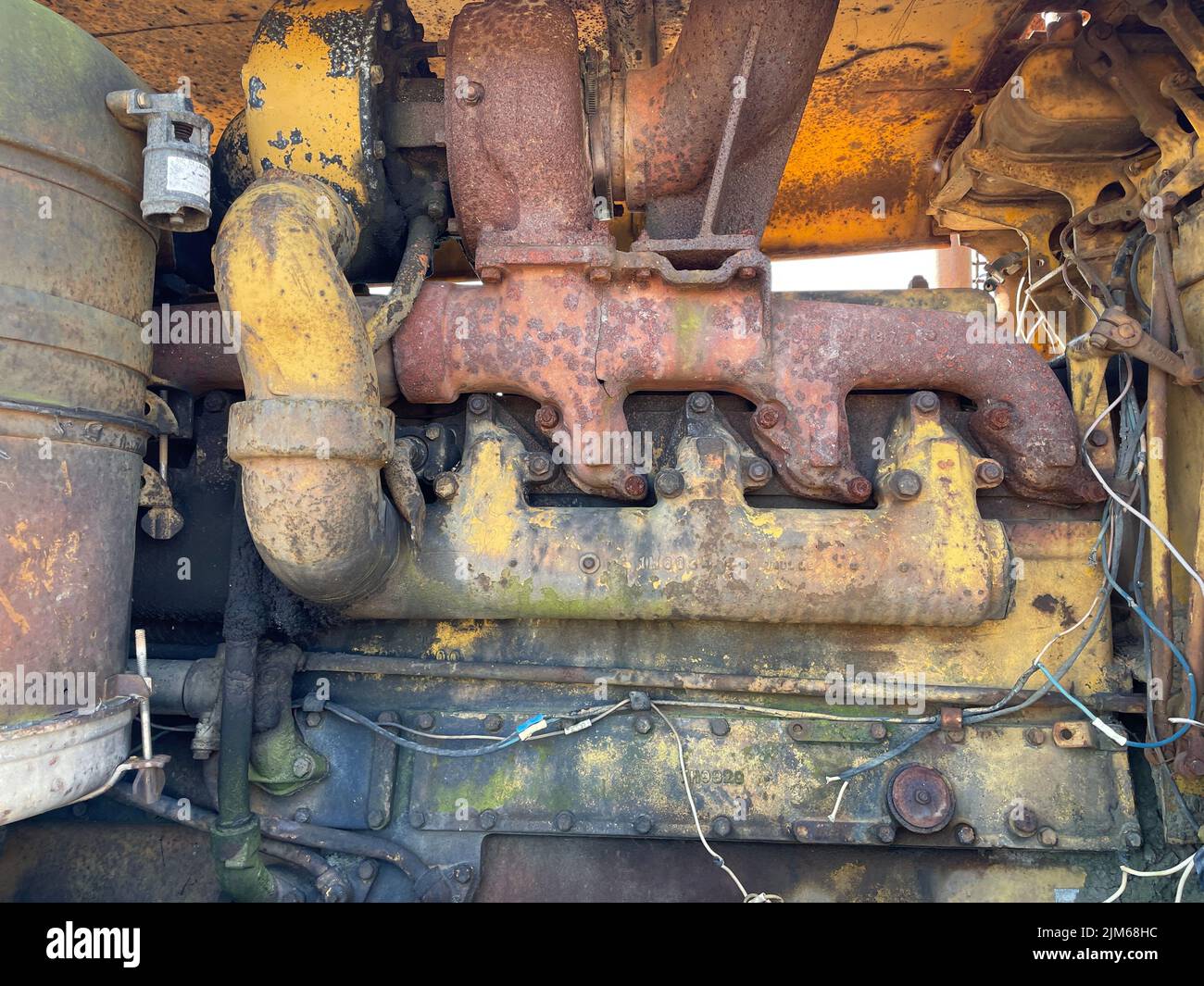 Burke County, Ga USA - 02 10 22: Old abandoned rusted tractor engine ...