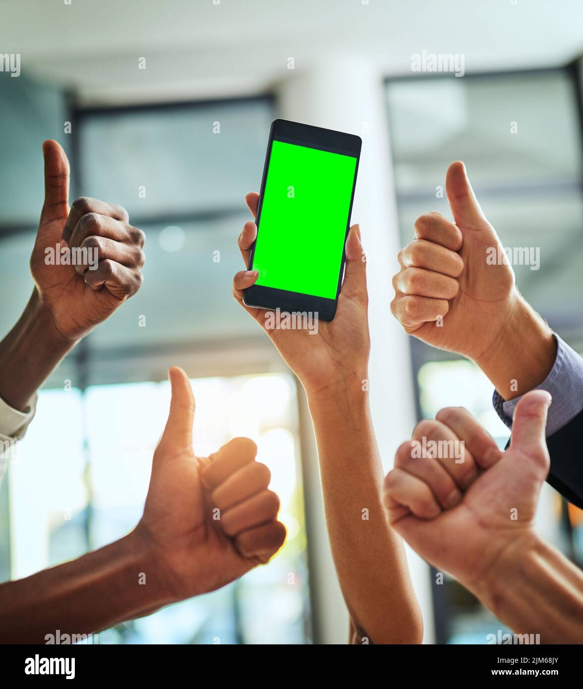 Green screen, copy space and chroma key on phone and thumbs up hand ...