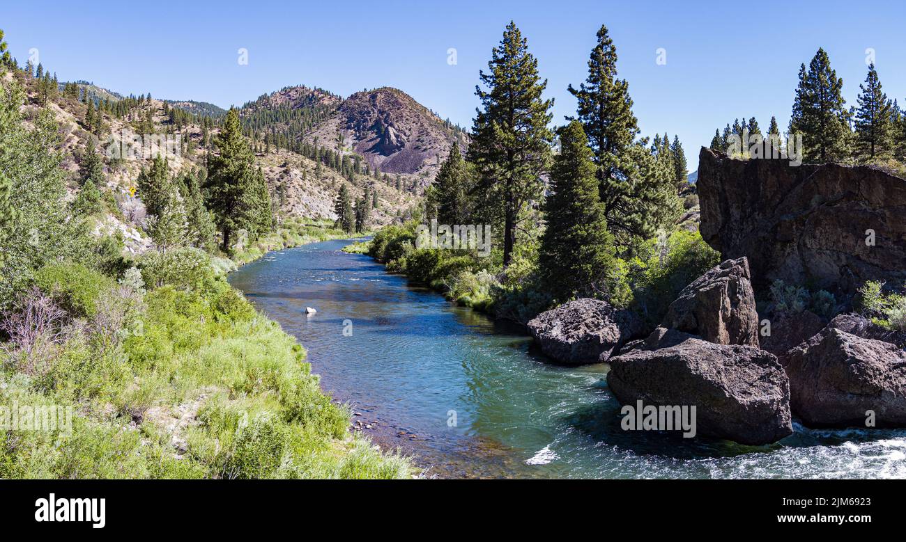 Calm waters flow peacefully through a valley in the California river ...
