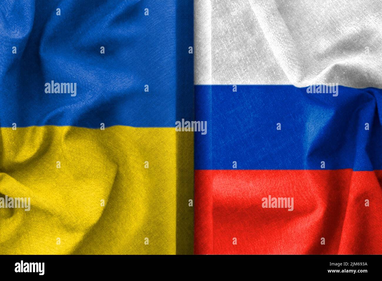 A split illustration of Ukraine and Russia flags depicting the conflict ...
