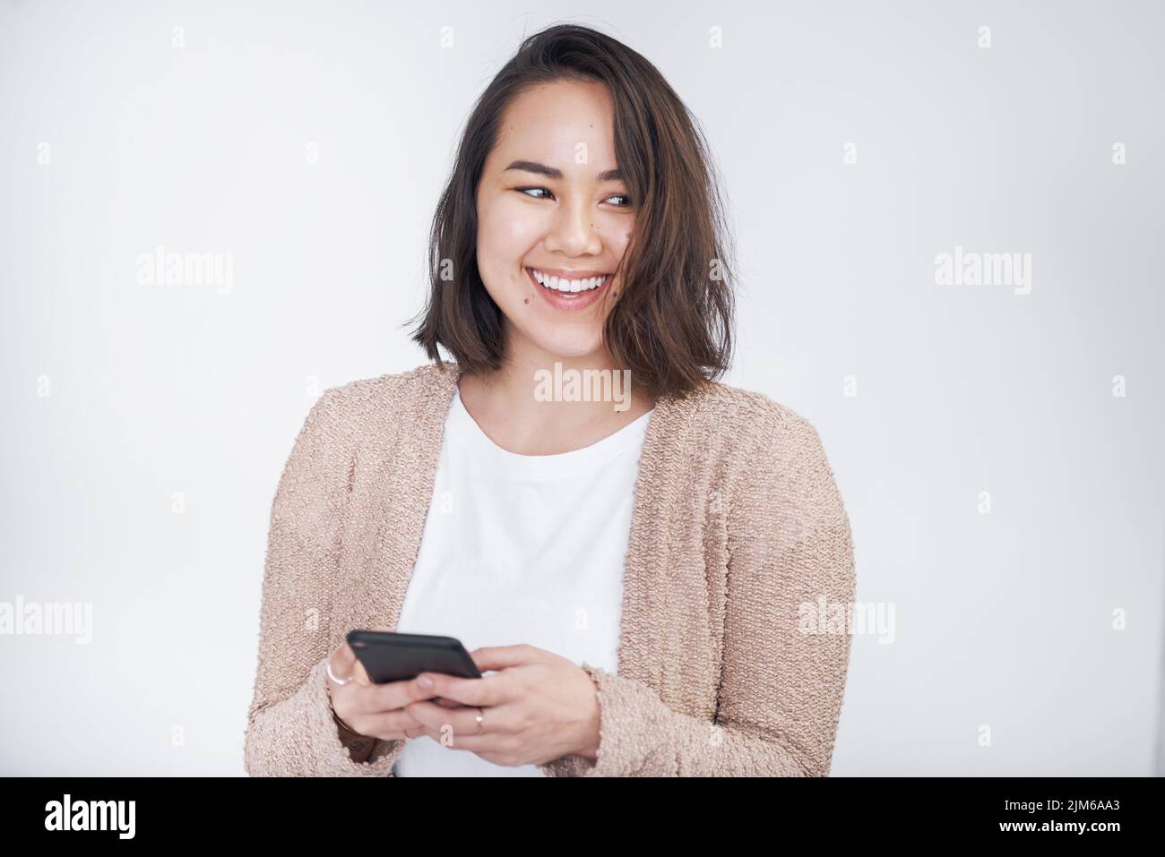 These text messages are for my eyes only. a beautiful young woman using ...