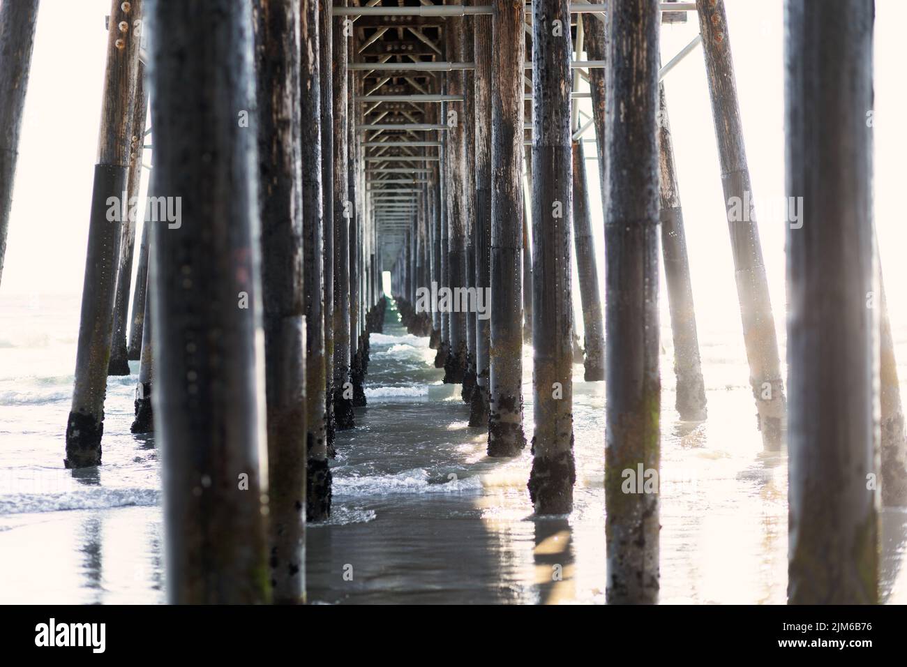 The rusty old columns of the design of down part of big bridge over ...