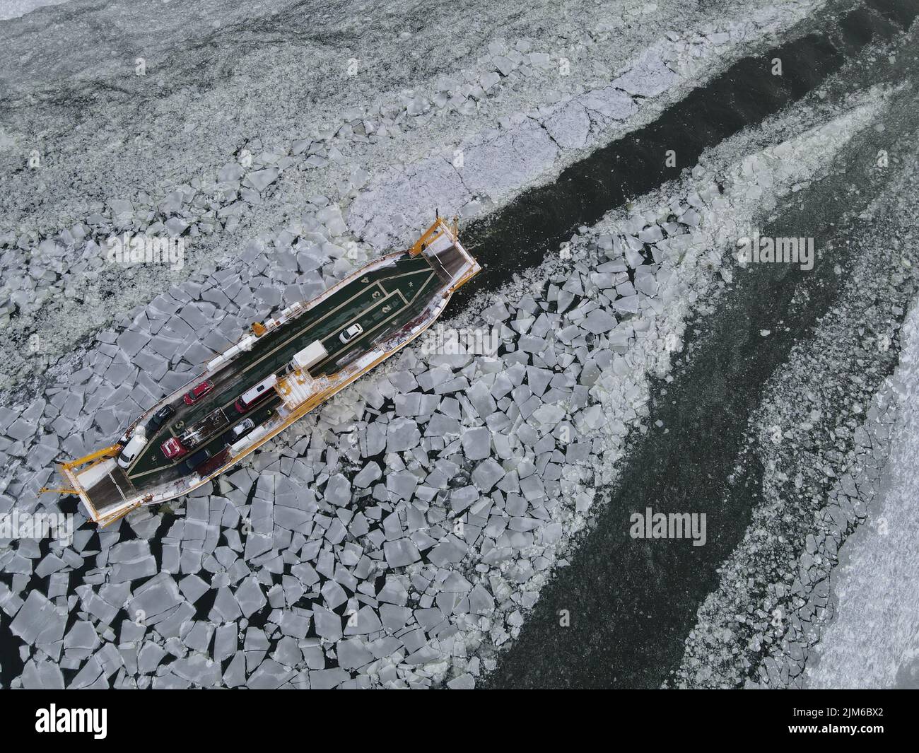 An aerial view of car ferry in a partly frozen lake Stock Photo - Alamy