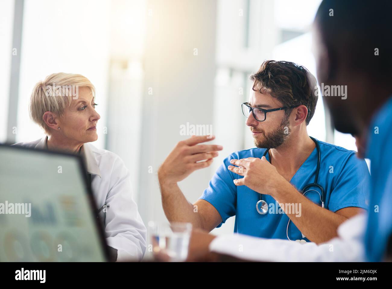 Doctor, healthcare professional and medical worker in a boardroom ...