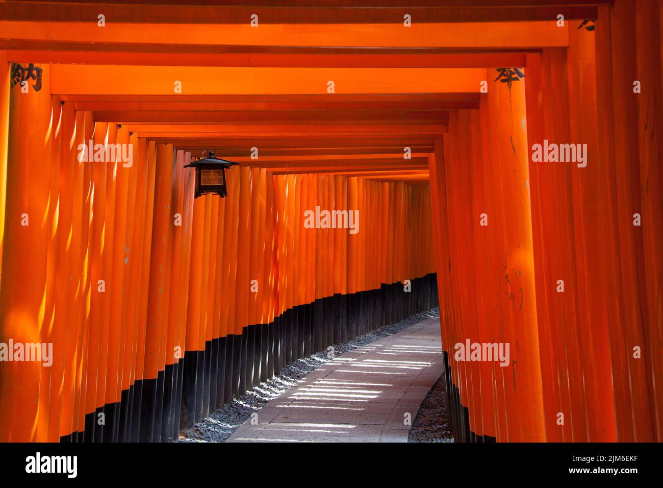 A path of the decorated wall of Fushimi Inari Taisha Shrine in Kyoto ...