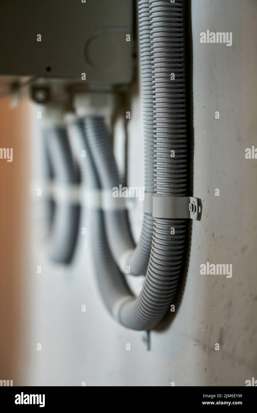 A vertical shot of an Inea cable internet installation box attached on ...