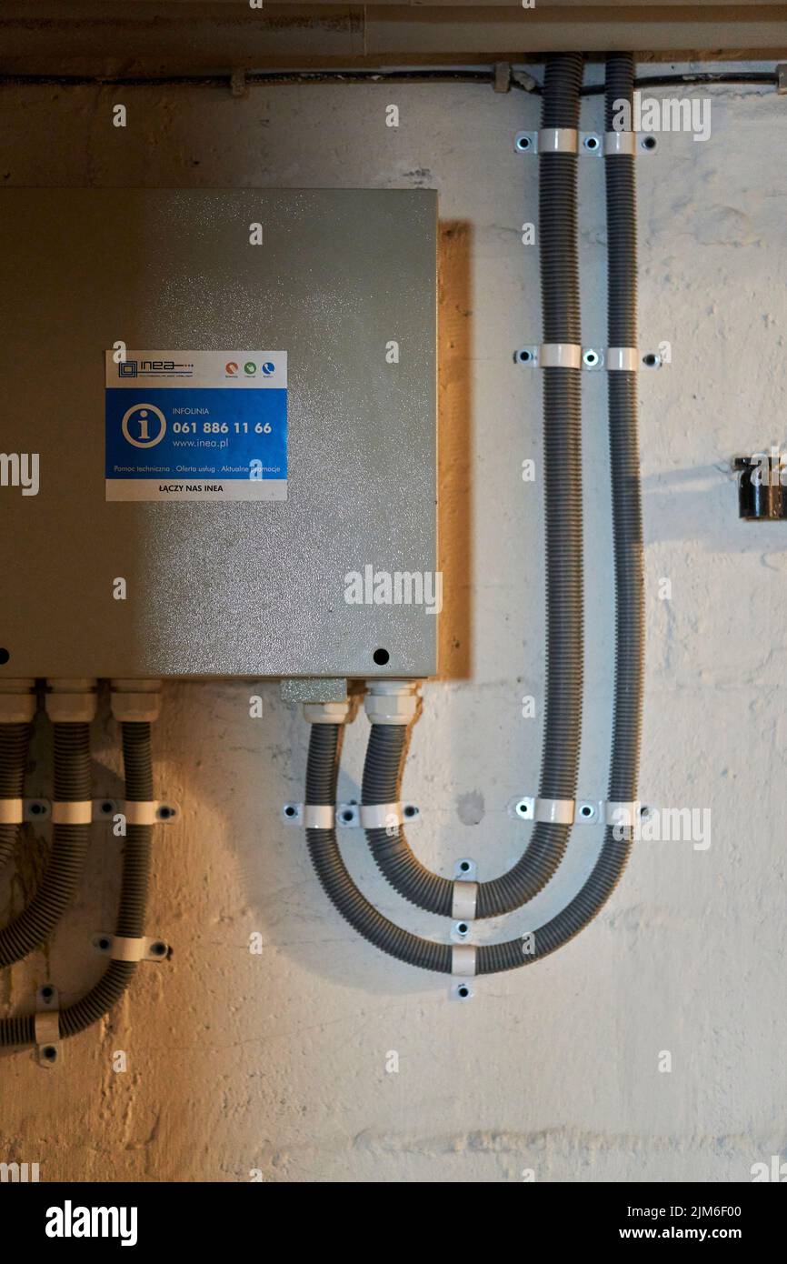 A vertical shot of an Inea cable internet installation box attached on ...