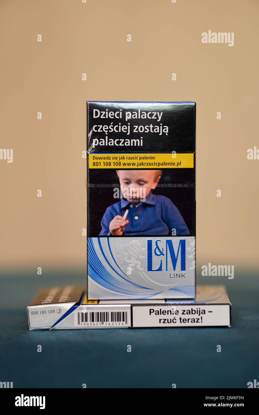 A vertical shot of L&M Link brand cigarettes in a box with a warning ...