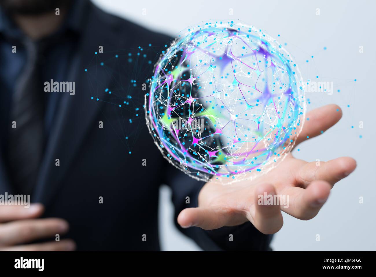 A businessman holding a bubble of network connection dots and lines on ...