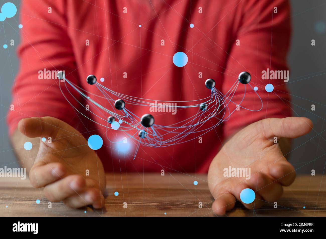 A hologram of a 3D rendered network symbols with a person behind ...
