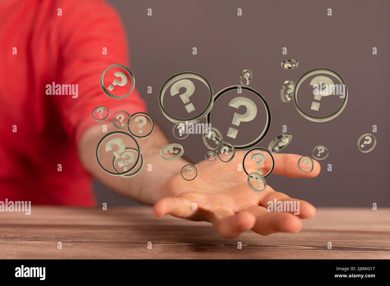 The hologram of 3D rendered question mark signs and person behind ...