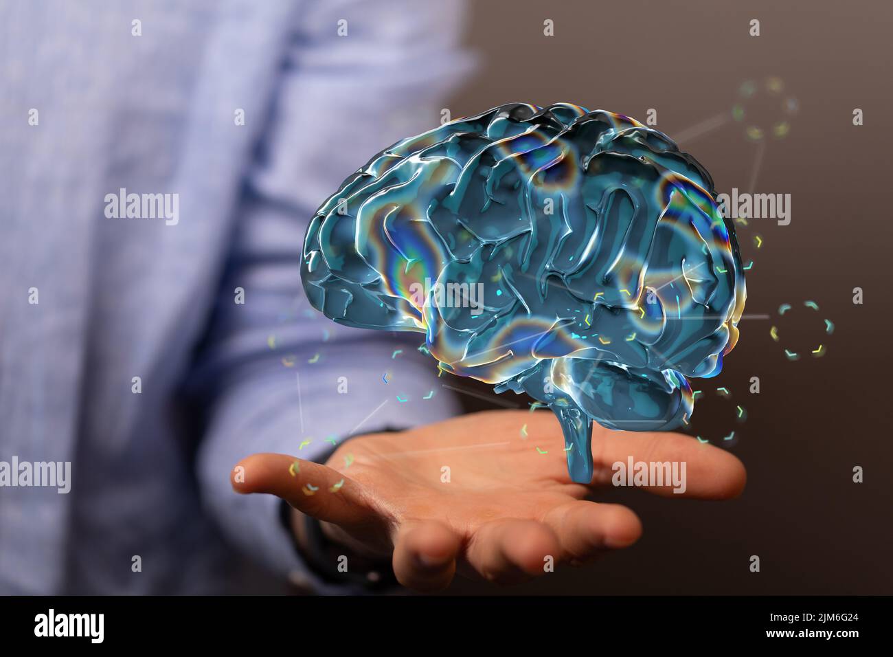 A hologram of a 3D rendered brain symbol with a person behind ...