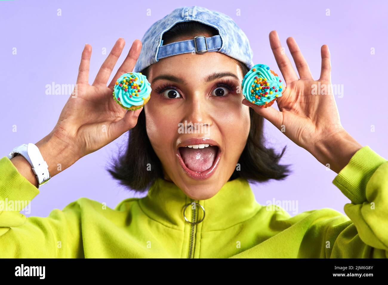 Woman posing cupcakes hi-res stock photography and images - Alamy