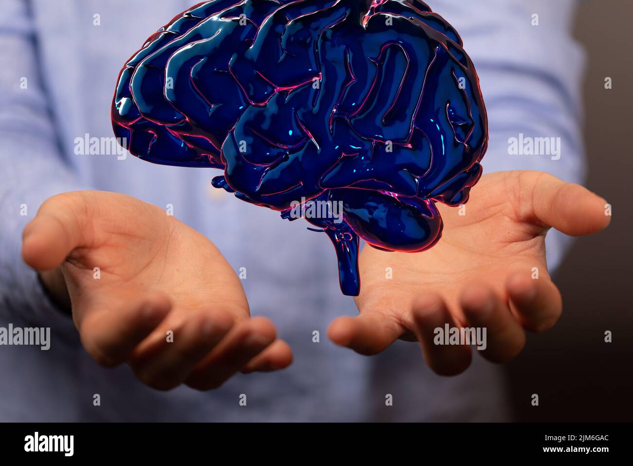 A 3D render of a human brain floating in the palm of a person in a ...