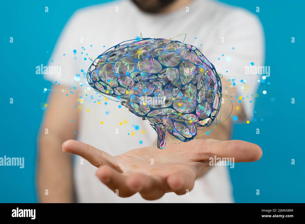 A 3D render of a human brain floating and being manipulated by a person ...