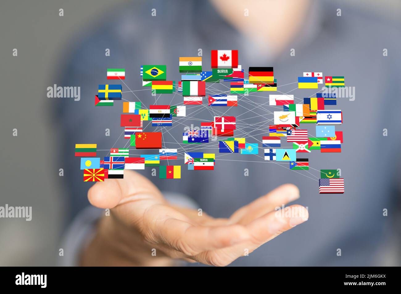 A 3D rendering of the world's national flags on a blurry background ...