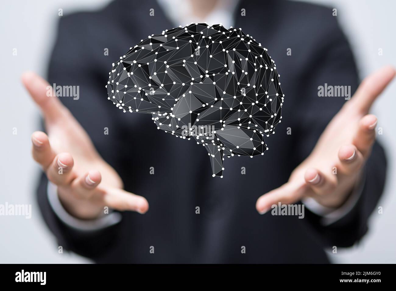 A 3D render of a human brain floating in the palm of a person in a ...