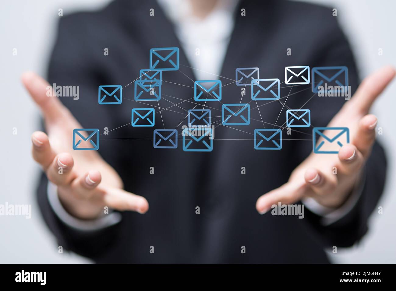 A blurred man holding symbol email icons concept of receiving and ...