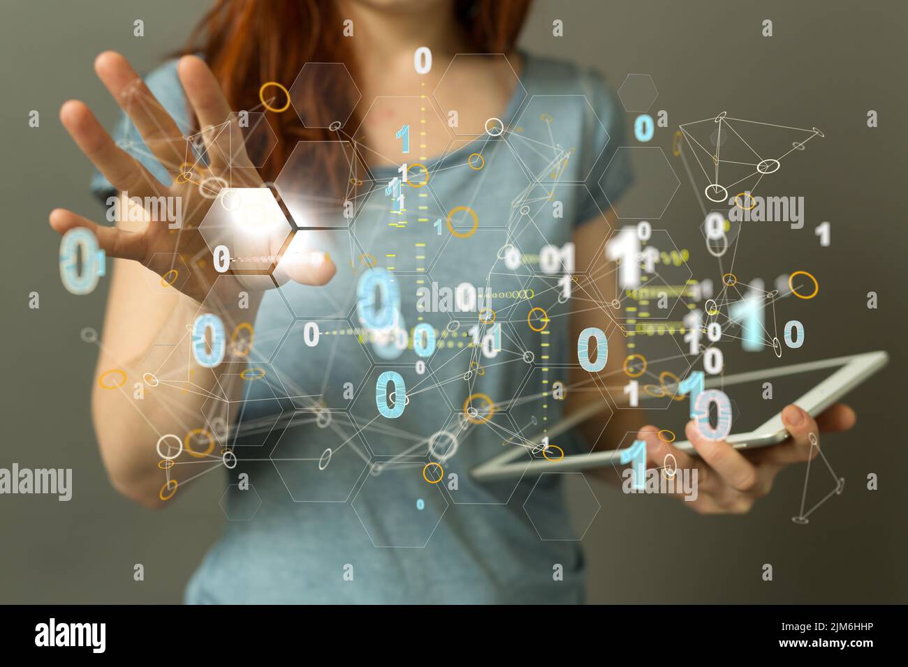 A Person With A Tablet Tapping On A Floating Digital Render Of A Binary 9696