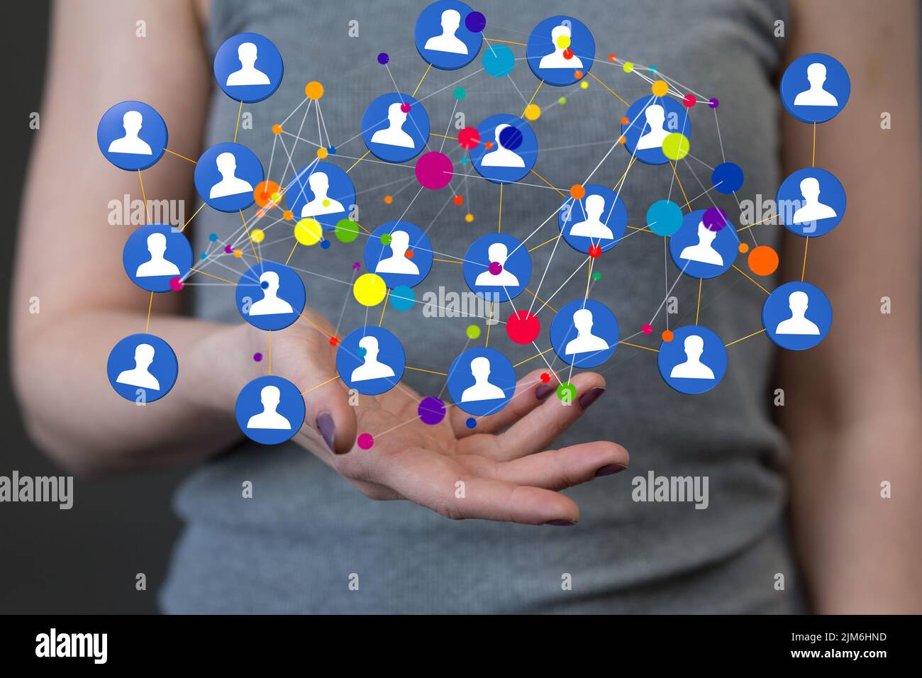 A person holding a floating digital render of interconnected profile ...