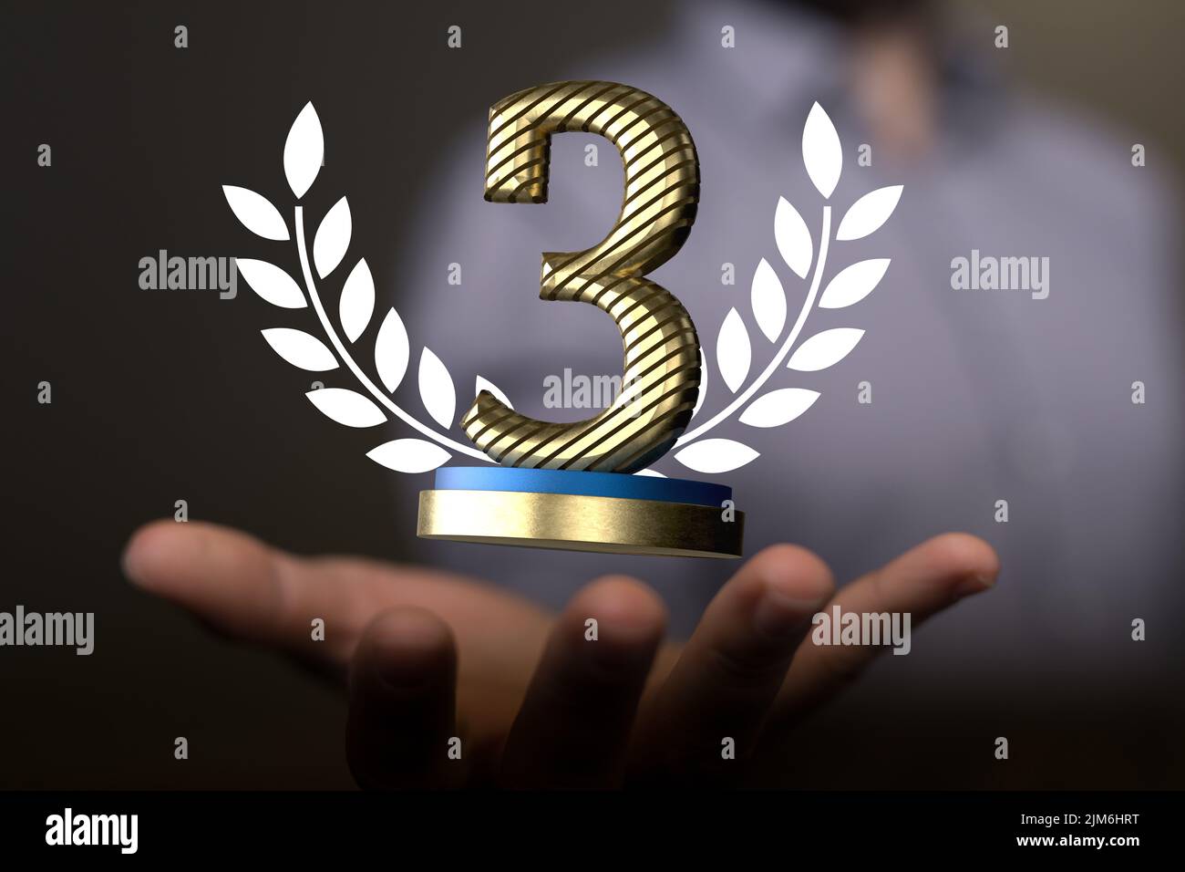A person holding a digital render of a third place trophy Stock Photo ...