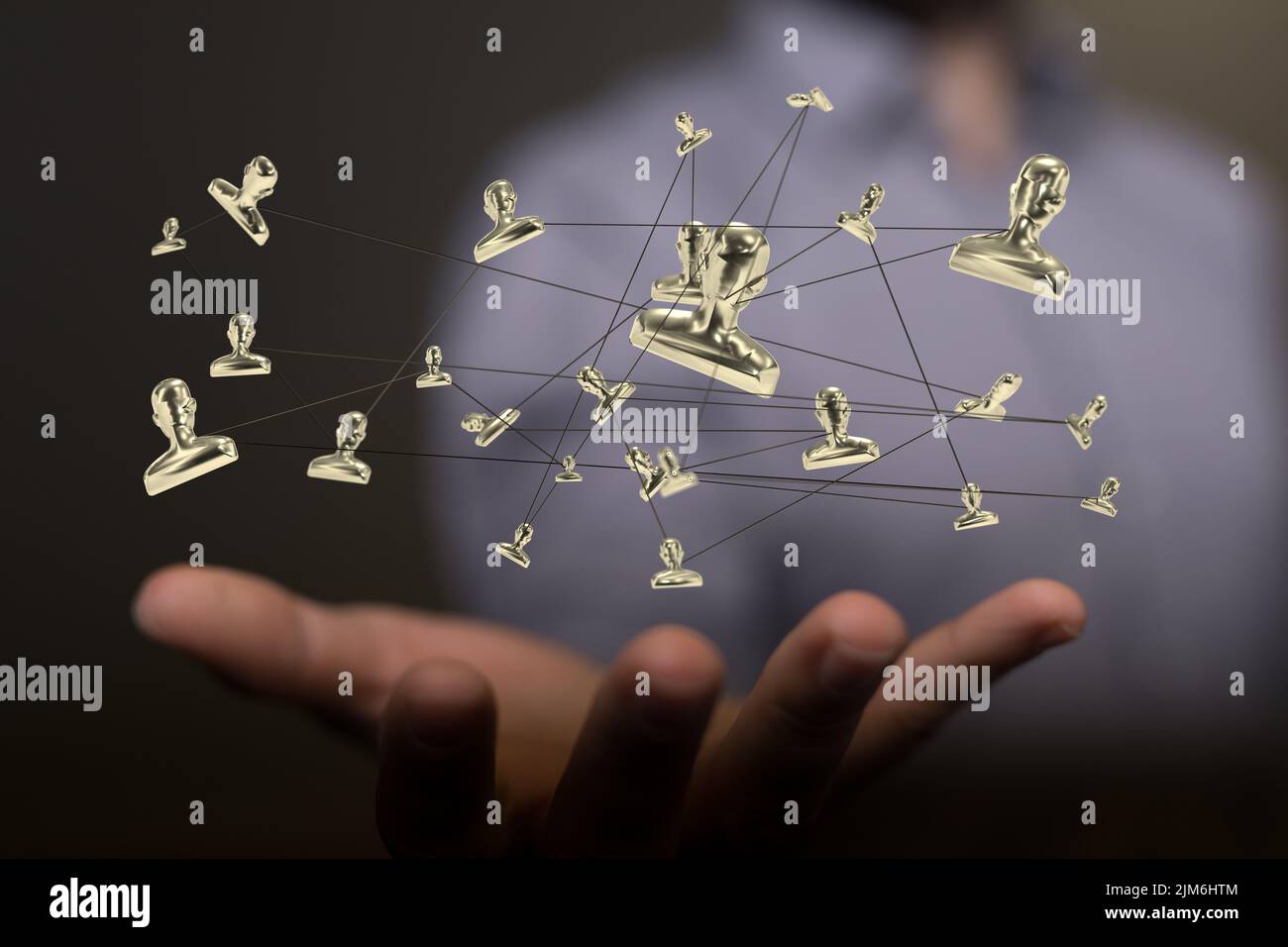 A businessman holding a floating digital render of interconnected profile icons-networking ...