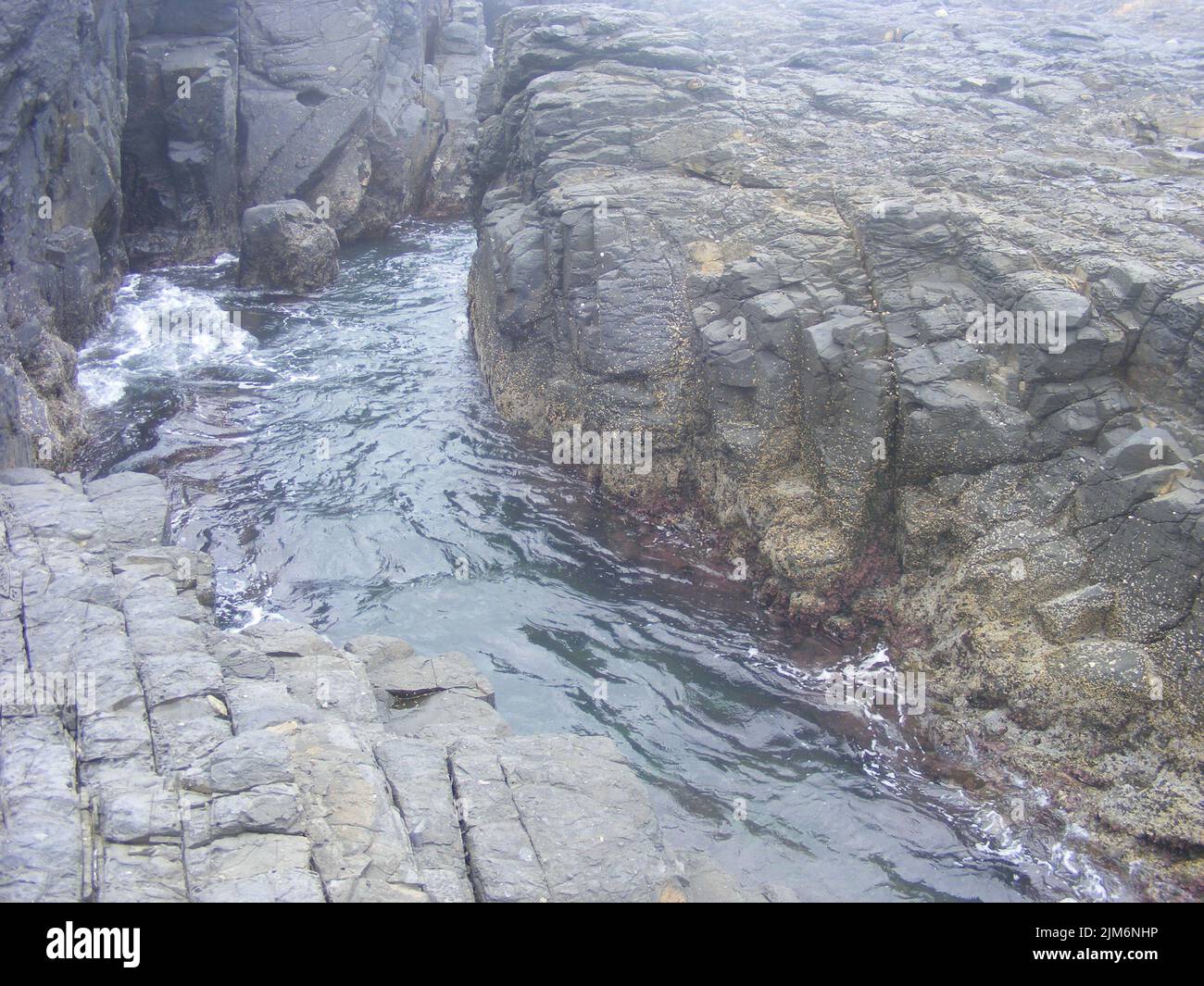 A narrow valley between hills with a gorge running through it Stock ...
