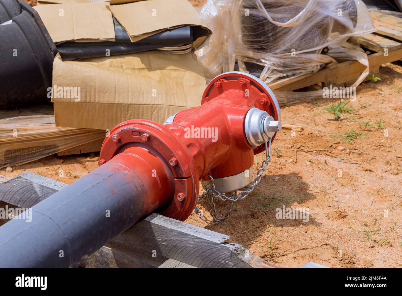 As part of the construction site preparation, a fire hydrant is set up ...