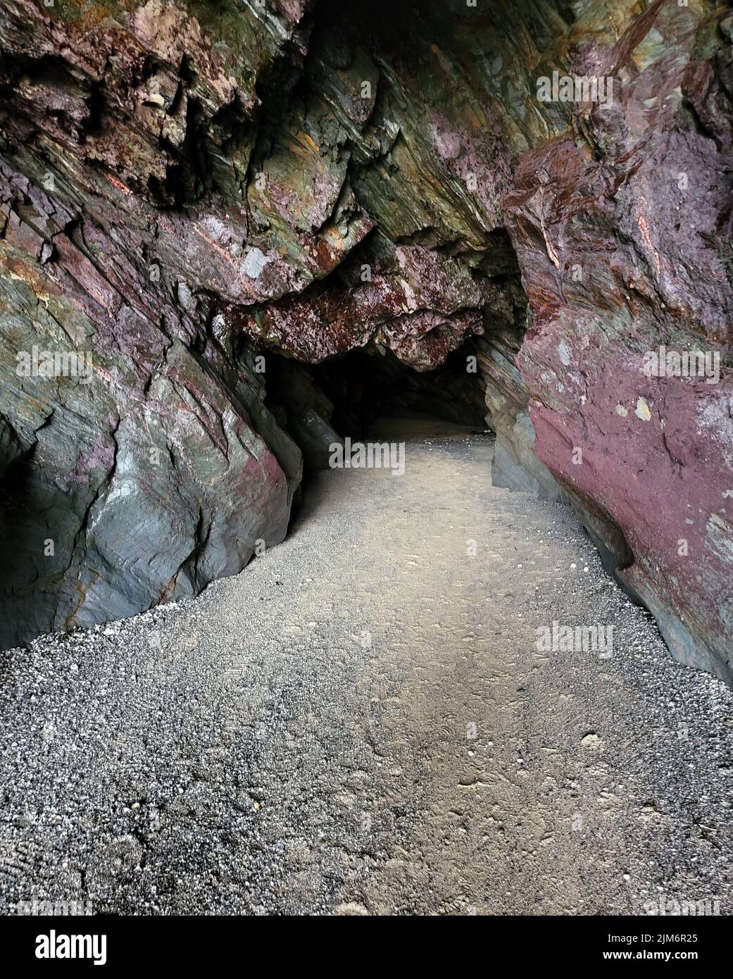A path leading to an old dark cave Stock Photo - Alamy