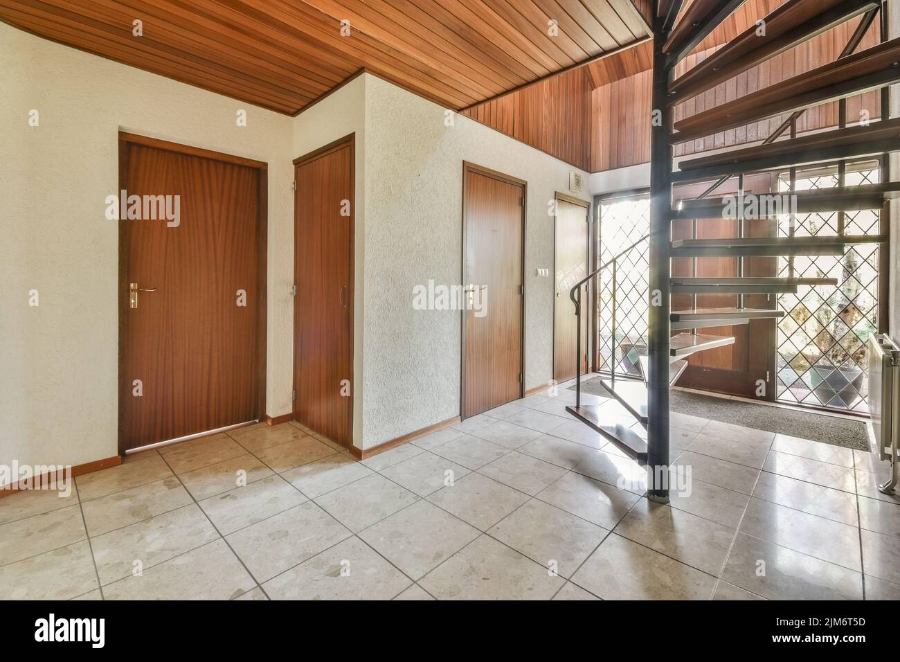 Plastic window and radiator on white wall in empty light room at home ...