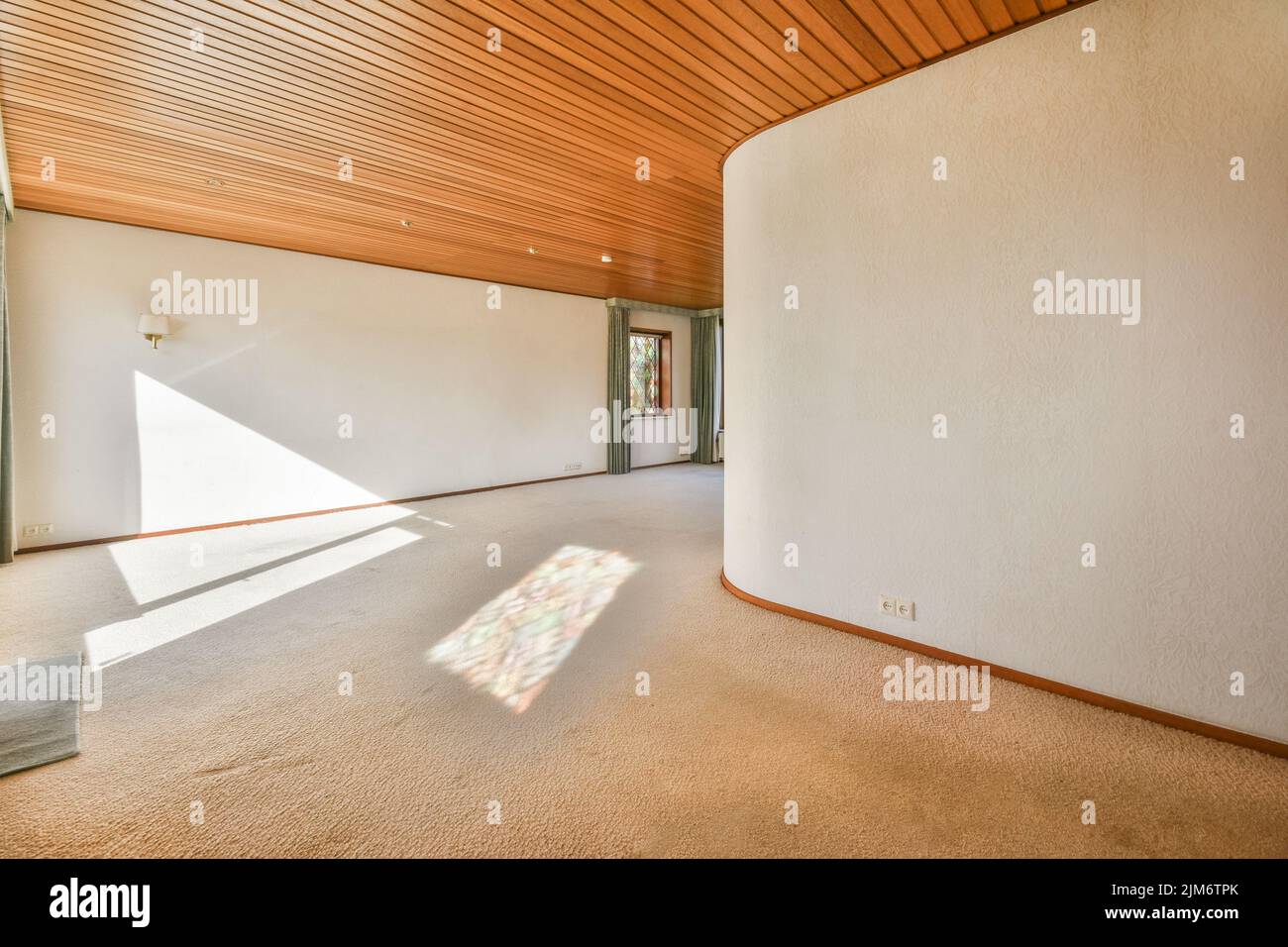 Plastic window and radiator on white wall in empty light room at home ...