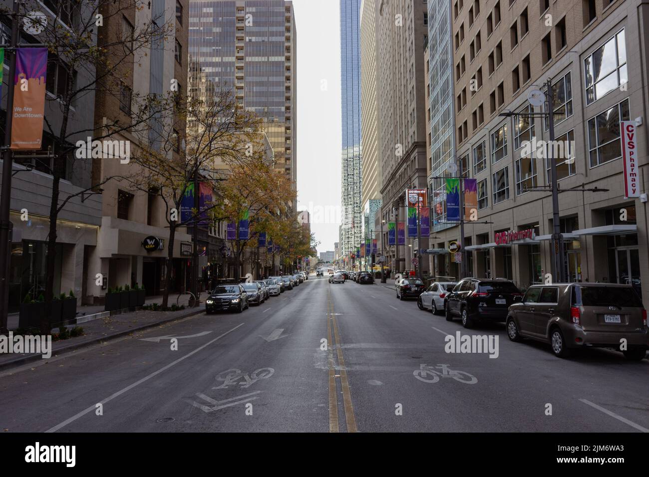 The buildings and street with parked vehicles in Downtown Dallas Stock ...